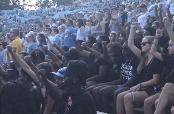 VIDEO: Large group of protesters sit, raise fists during national ...
